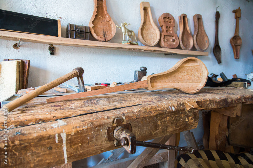 Luthier table with a wooden musical instrument Stock Photo | Adobe Stock