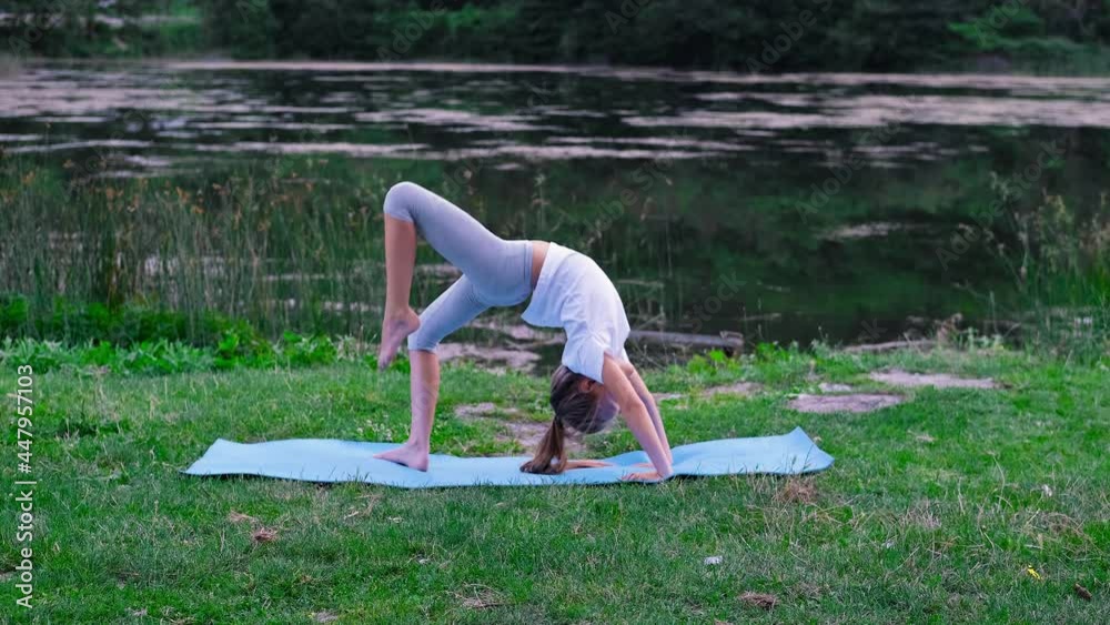 The child stands in a bridge position and lifted his leg up. A little ...