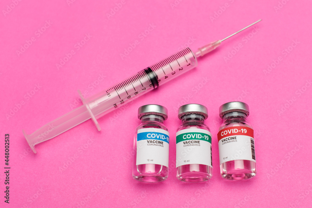 Medical syringe with needle and 3 sealed glass capsule of covid-19 ...