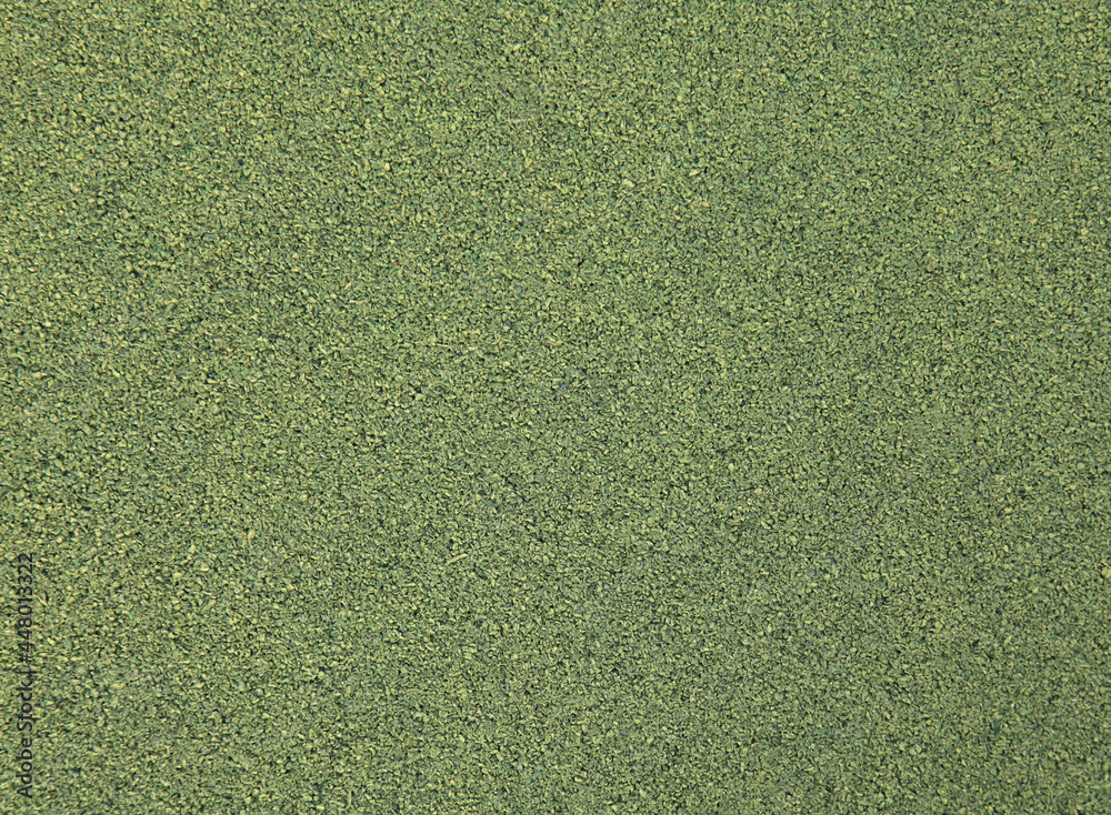 Green rubber floor, texture, background. Relief surface. Faded, old ...