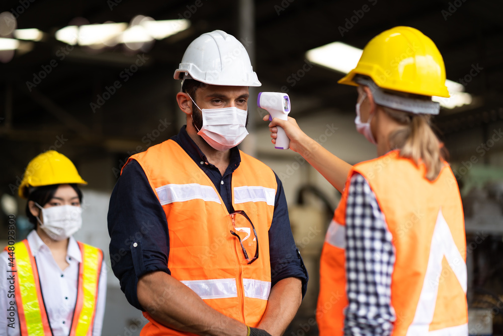 Temperature measurement with employee temperature meter before entering ...