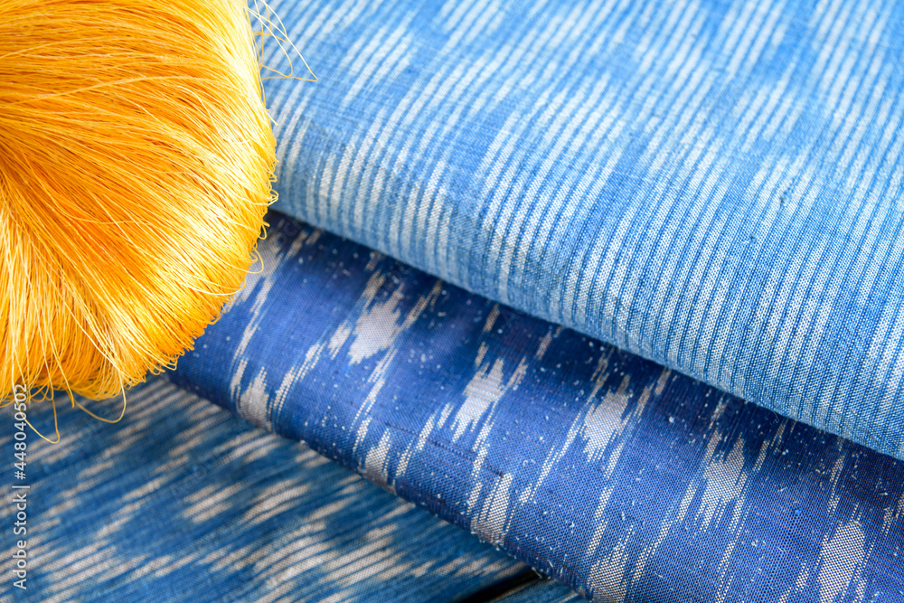 Crafts and craftsmanship. Traditional Isan Thai silk indigo weaving ...