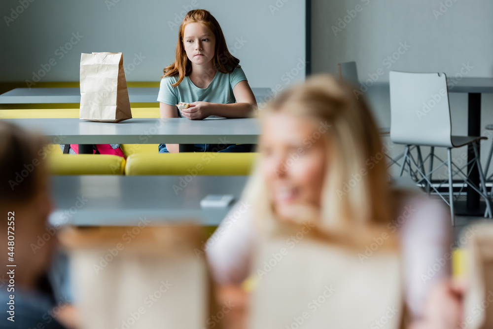Girl Sitting Alone In School