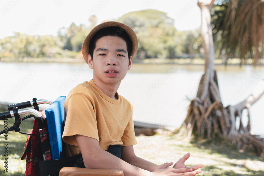 Asian Disabled child on wheelchair is playing, learning and exercise in ...