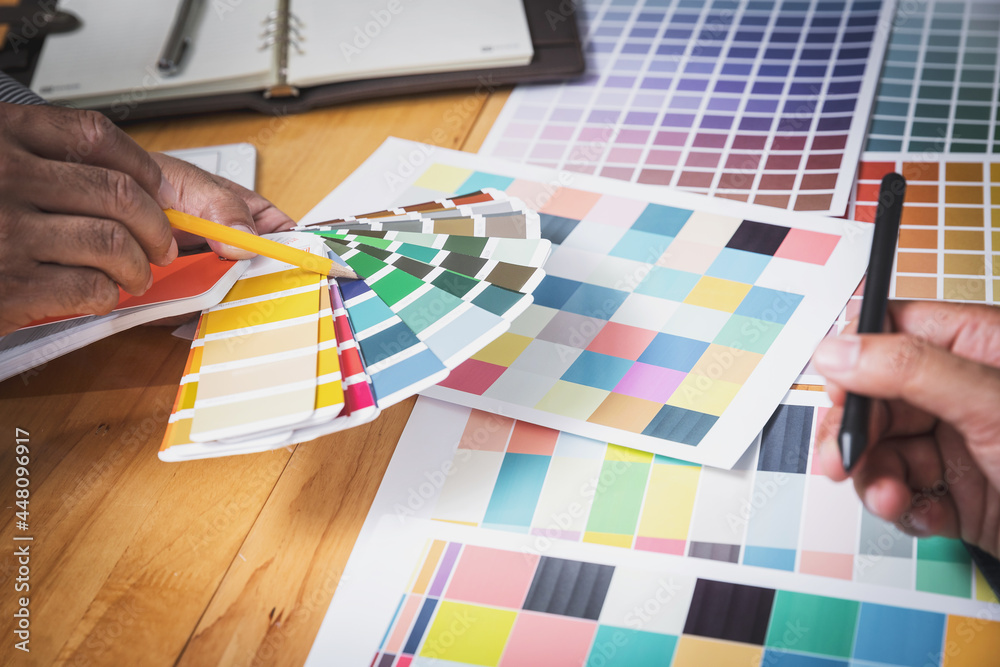 Interior designer chooses a color chart for home design. Graphic ...