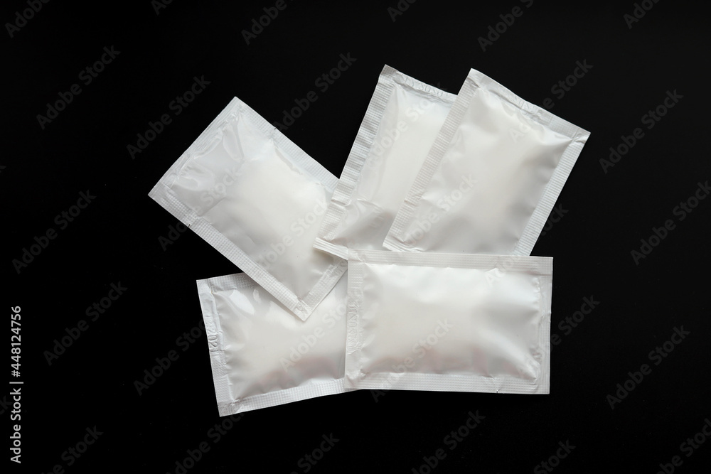 Blank white sachet packets stack mockup isolated on black background ...