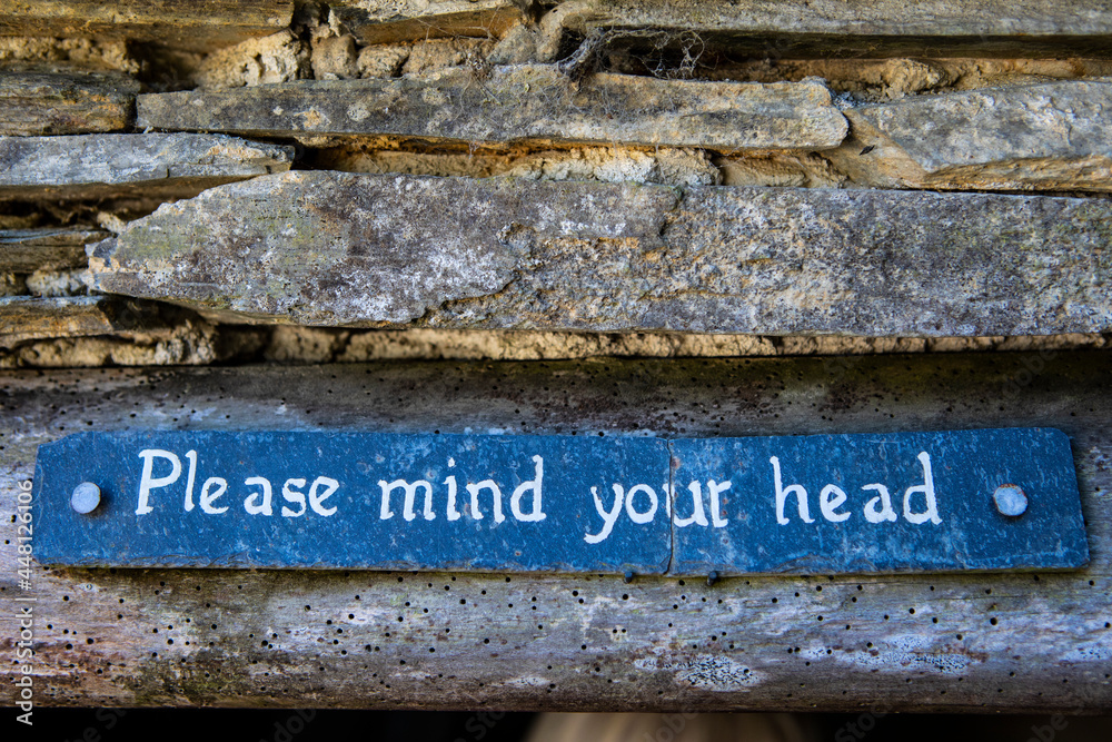 Please Mind Your Head Sign Stock Photo | Adobe Stock