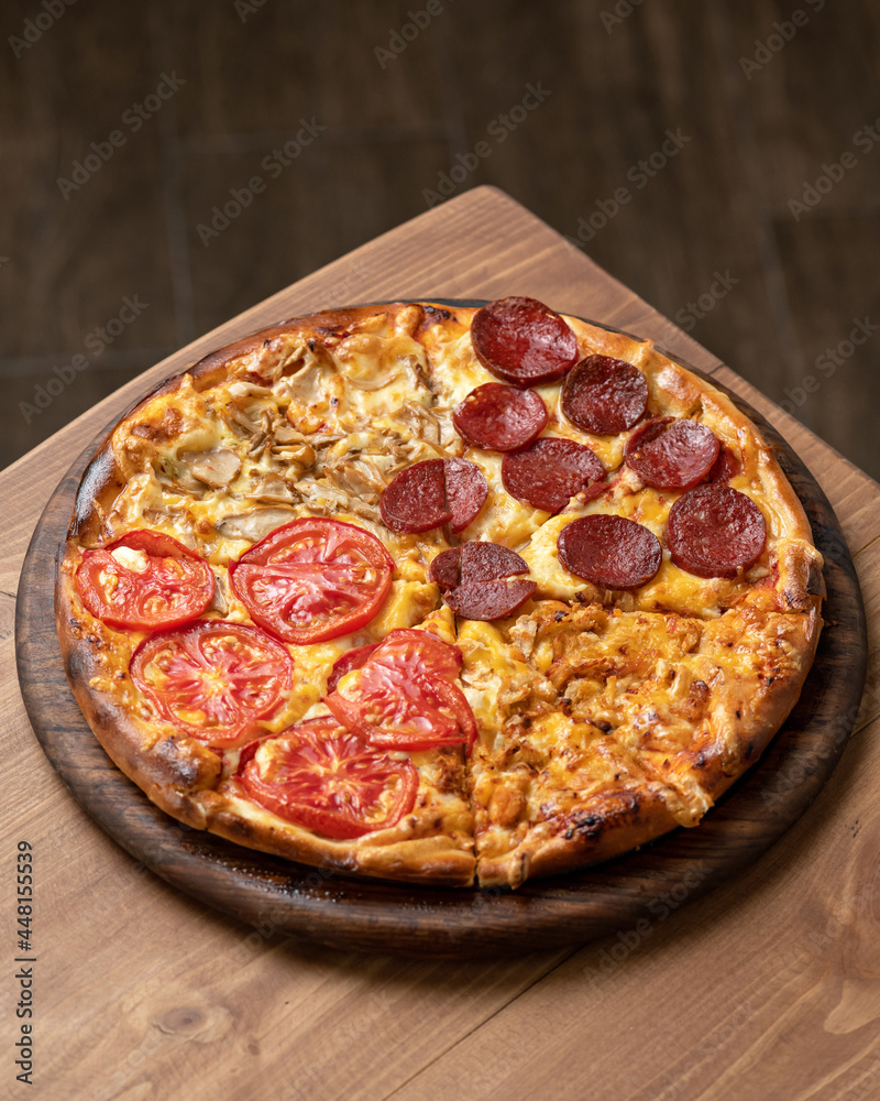 Hot pizza, four in one. Chopped pizza with four types of toppings on ...
