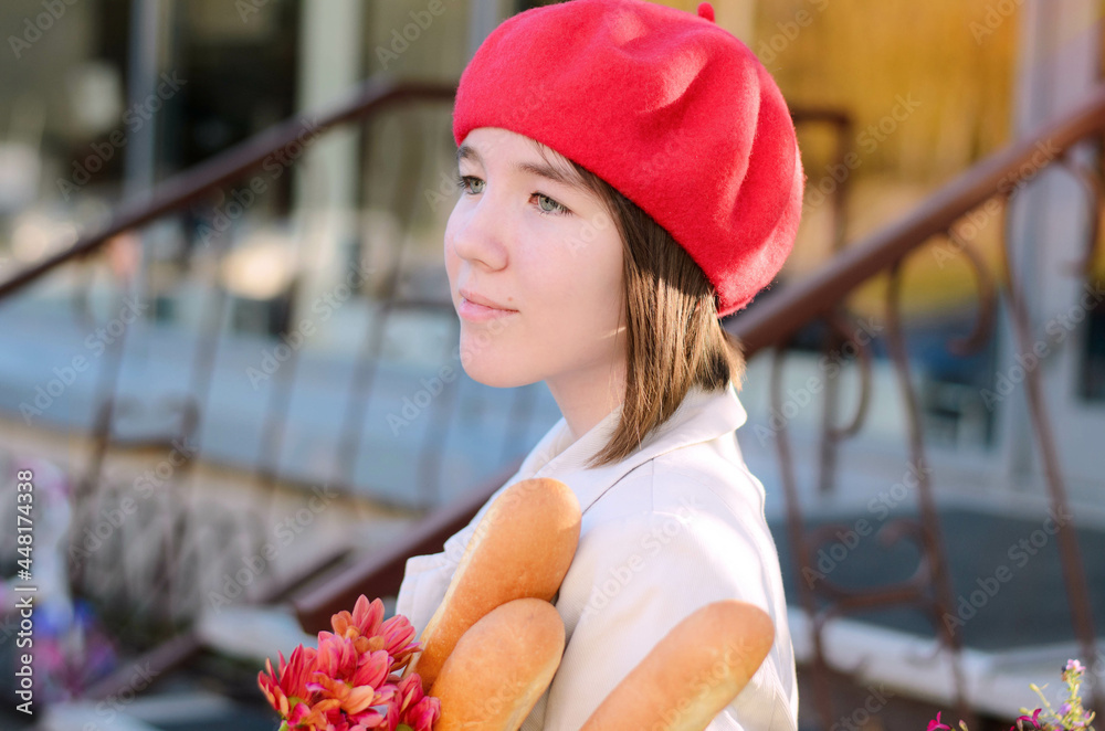 Young girl with short hairdo wear french red beret hold in hands crispy ...