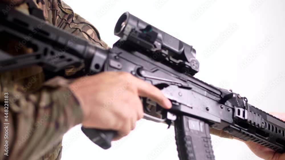 Navy SEAL sergeant in tactical multicam camouflage aims his combat ...