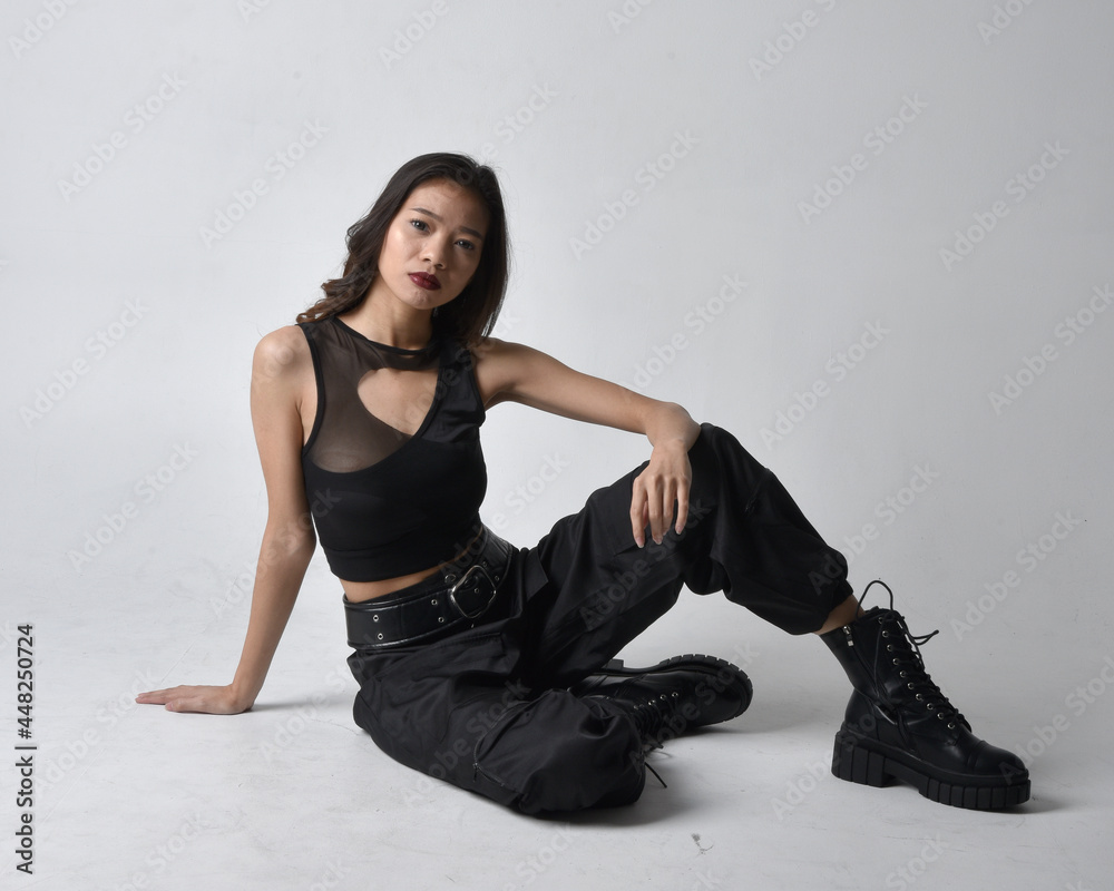 Full length portrait of pretty young asian girl wearing black tank top ...