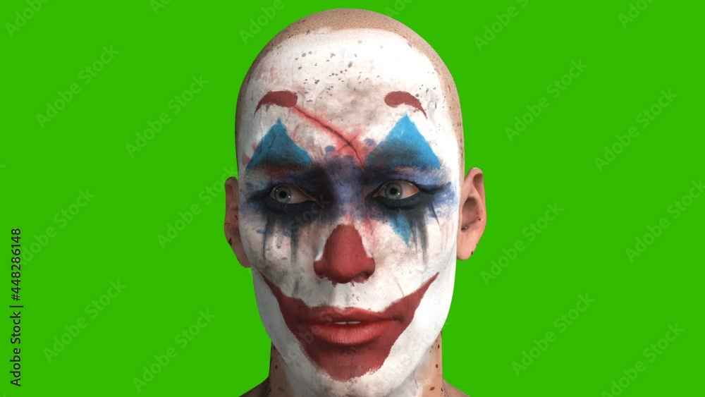 A terrible and creepy clown is surprised and looks in fright on the ...