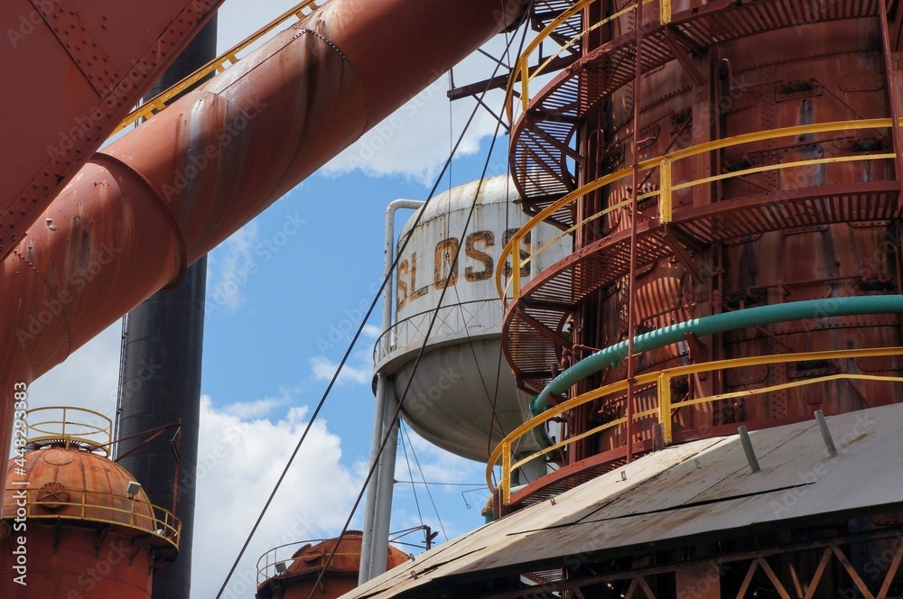 Sloss furnaces water tower with rusty buildings and silos Stock Photo ...