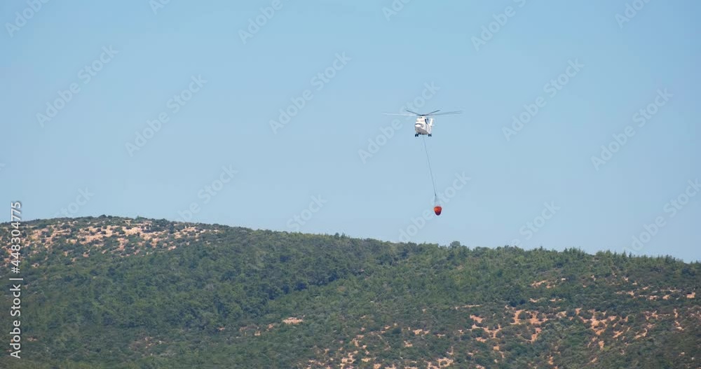 Fire fighting concept: Huge white firefighter helicopter with a long ...