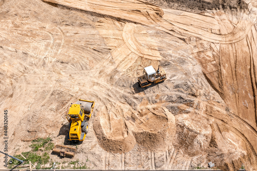 aerial top view of construction machines. industrial road rollers is ...
