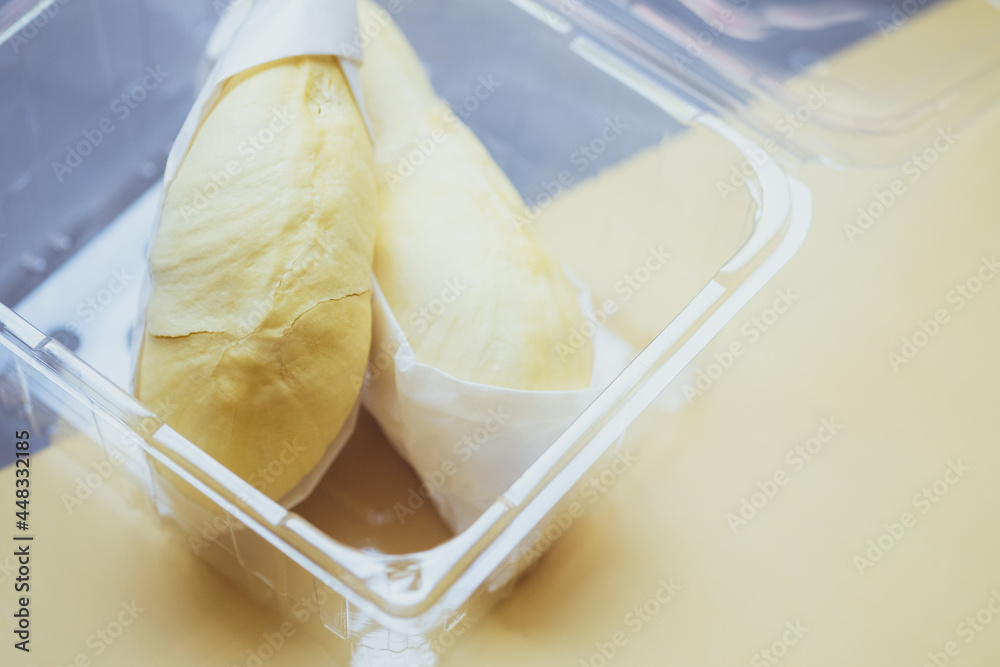 Fresh yellow durian in a plastic box. Ripe durian, the king of fruits ...