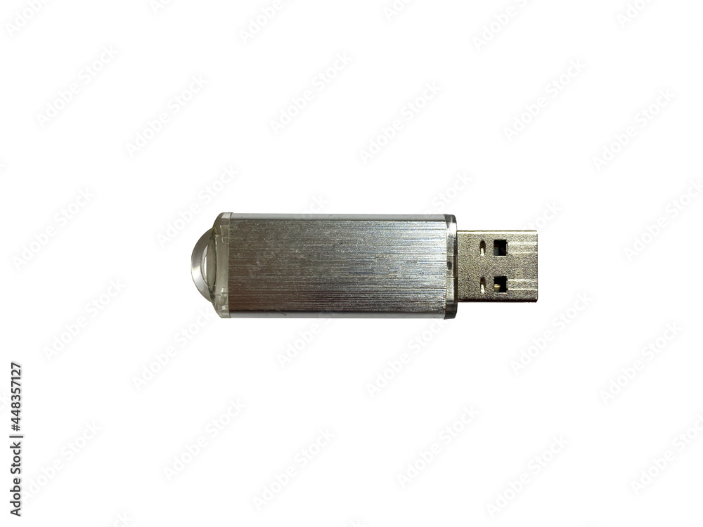 Silver flash drive close-up on a white isolated background. A USB flash ...