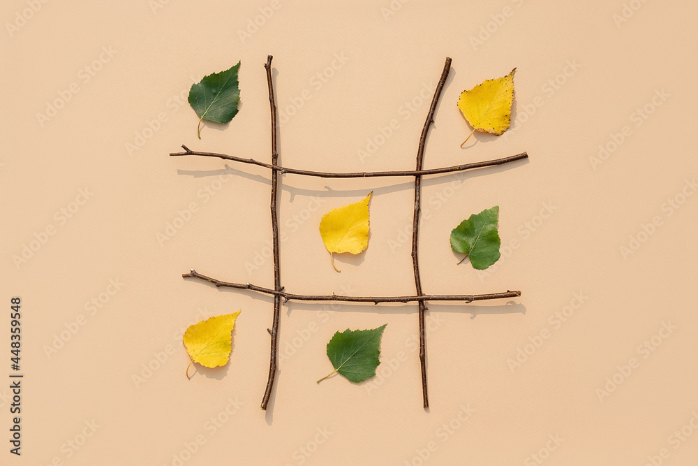 Creative autumn concept. Tic-tac-toe, noughts and crosses between ...