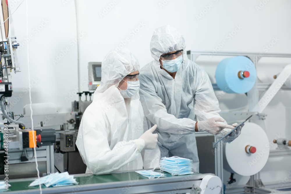 Male Engineers wearing personal protective equipment or PPE to protect ...