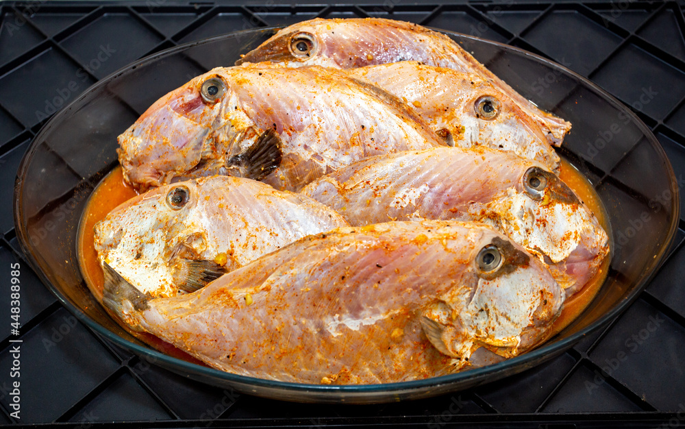 Clean and seasoned Peroá fish (Balistes capriscus) ready to be roasted ...