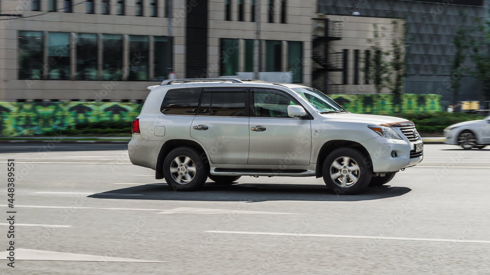 Side view of Lexus LX 570 Third generation J200 suv in motion. White ...