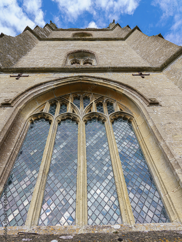 beautiful detailed church window with stained glass and arched stone ...