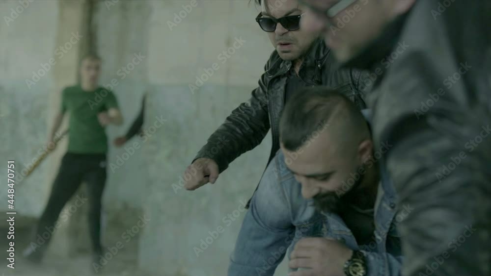 4k Group of men fighting in abandoned building . Friends helping each ...