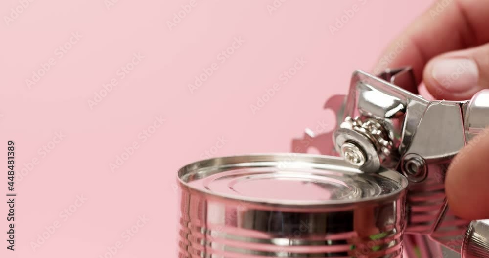 Close-up detail - opening Sweetened condensed milk Can with a can ...