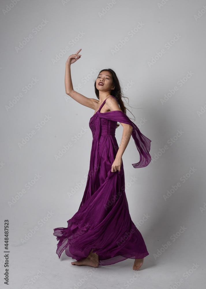 Full length portrait of pretty brunette asian girl wearing purple ...