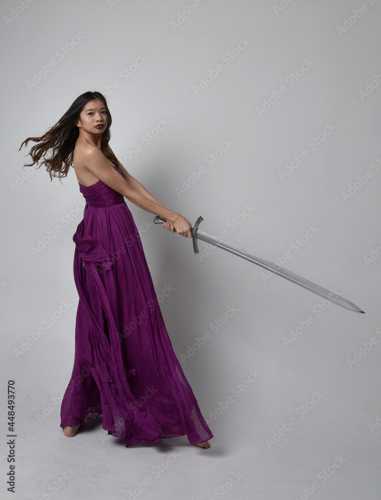 Full length portrait of pretty brunette asian girl wearing purple ...