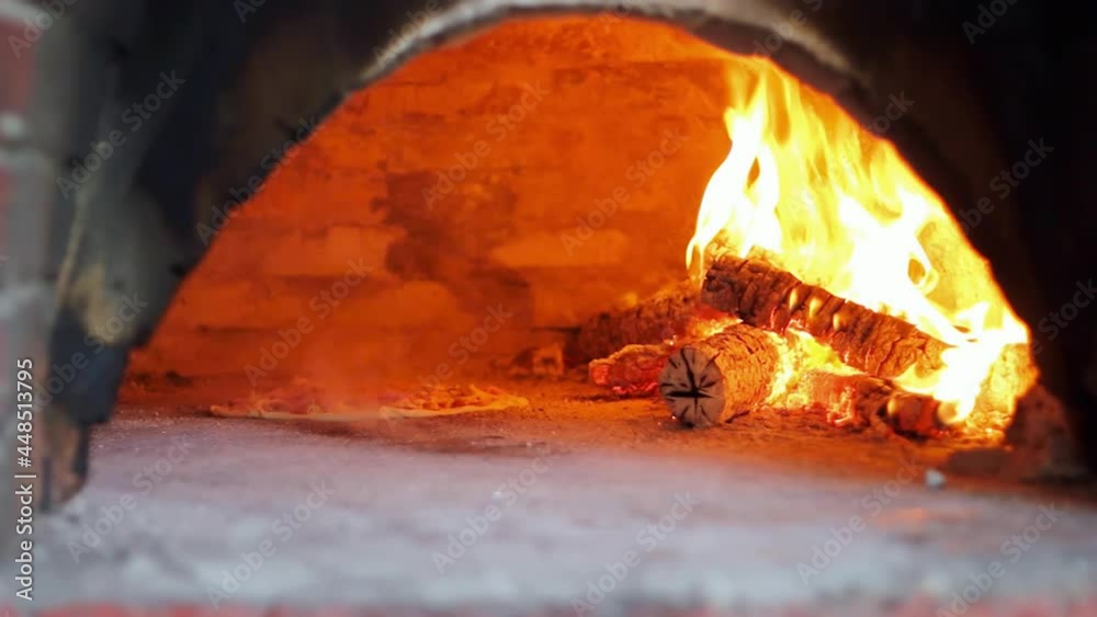 Pizza Baking in Traditional Pizza Oven with Fire Flames of Burning Woods - Pizza Chef Cooking ...