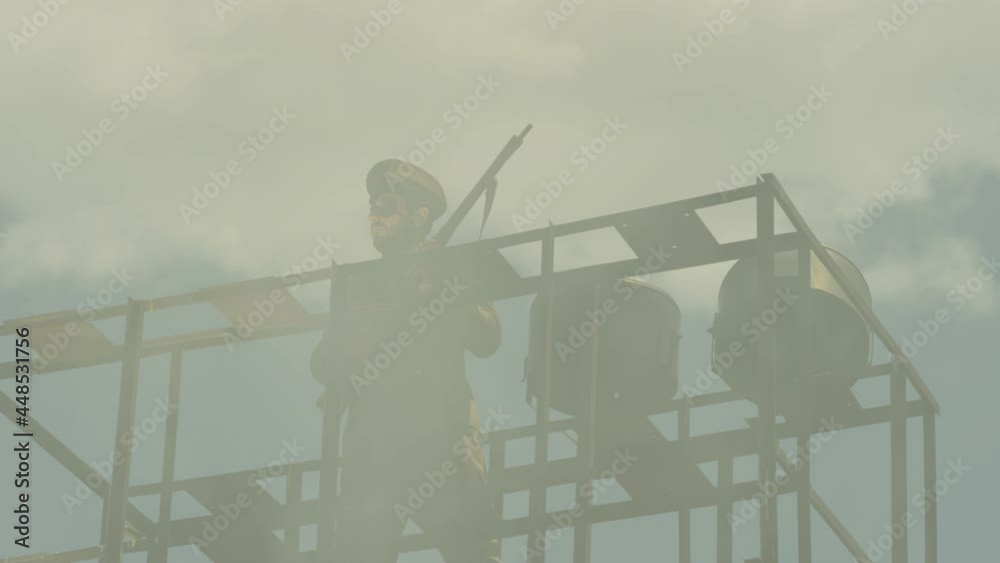 Security , guard , policeman stay in watch tower and looking around ...