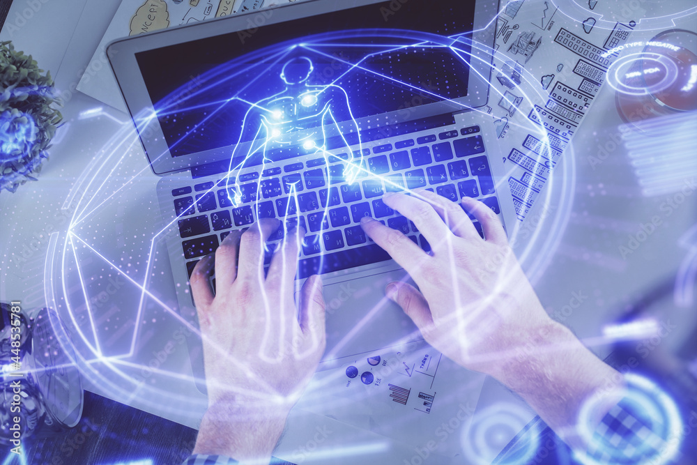 Double exposure of man's hands typing over computer keyboard and ...