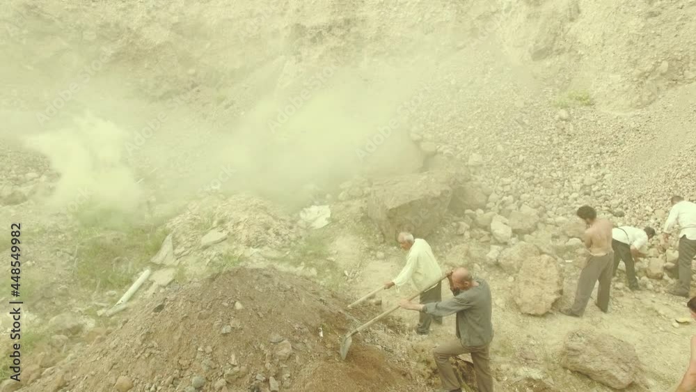 Aerial view of quarry , where working a group of miners or gold diggers ...