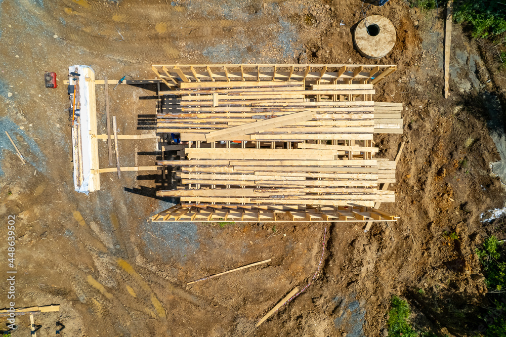 Stages of construction houses wood build roof. Slab in and framework ...