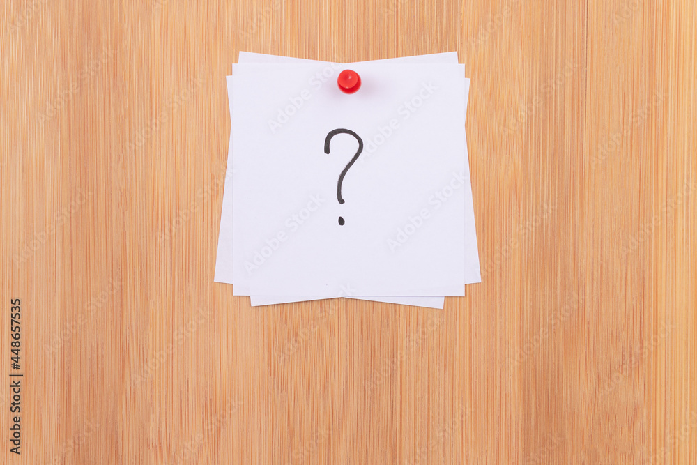 White Sticky Notes with Question Mark Pinned to the Wooden Message ...