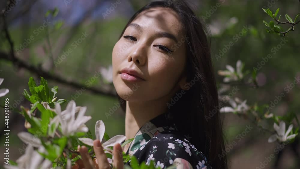 Headshot portrait of confident beautiful Asian young woman posing at ...