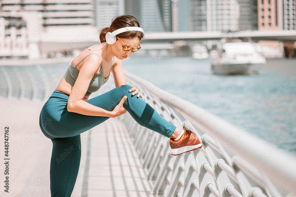 Young woman was running along the embankment and suddenly felt a sharp ...