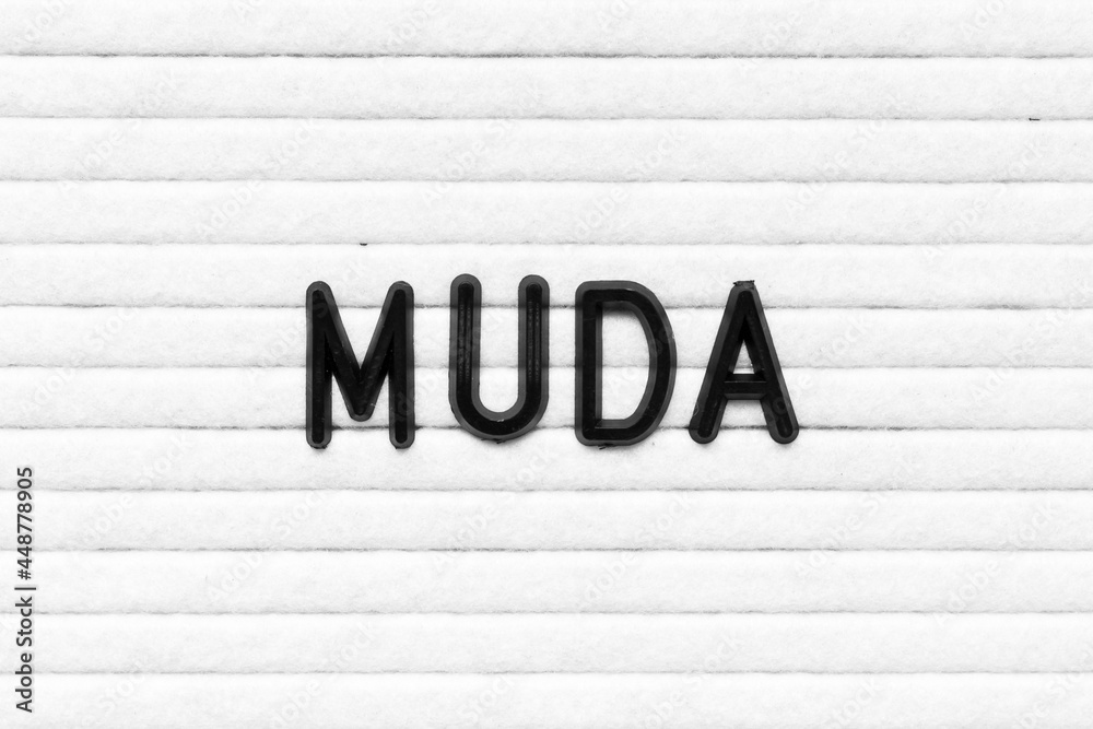 Black alphabet letter in word muda on white felt board background Stock ...