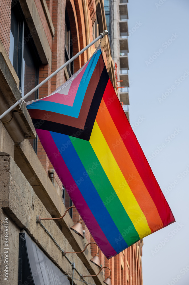 Progress Pride Flag hanging on building - pride flag and the colors of ...