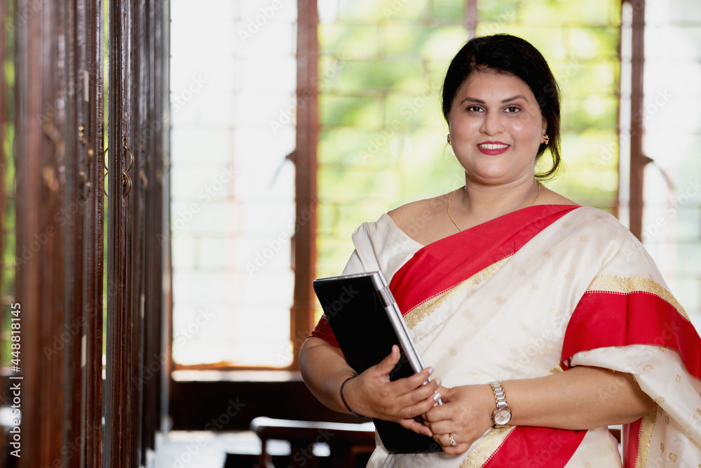 Portrait of indian teacher smiling towards the camera in saree Stock ...