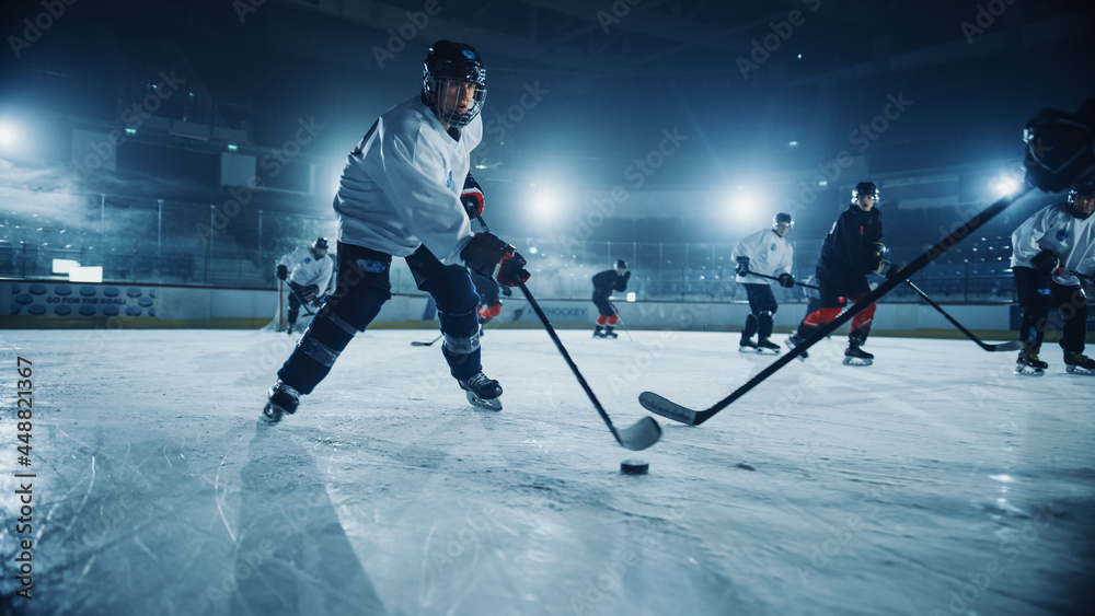 Ice Hockey Rink Arena: Professional Forward Player Masterfully Dribbles ...
