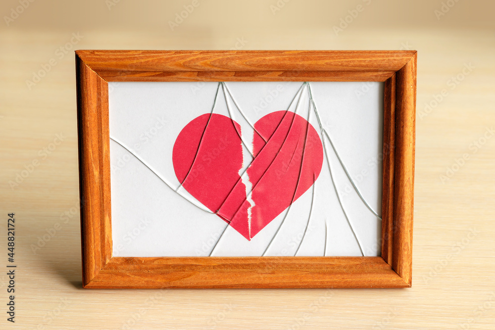 Torn paper heart in photo frame with broken glass Stock Photo | Adobe Stock