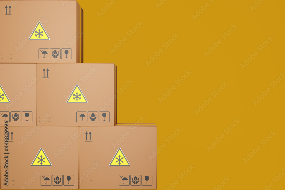 Dangerous goods, cardboard boxes with Frozen label on a yellow-brown ...
