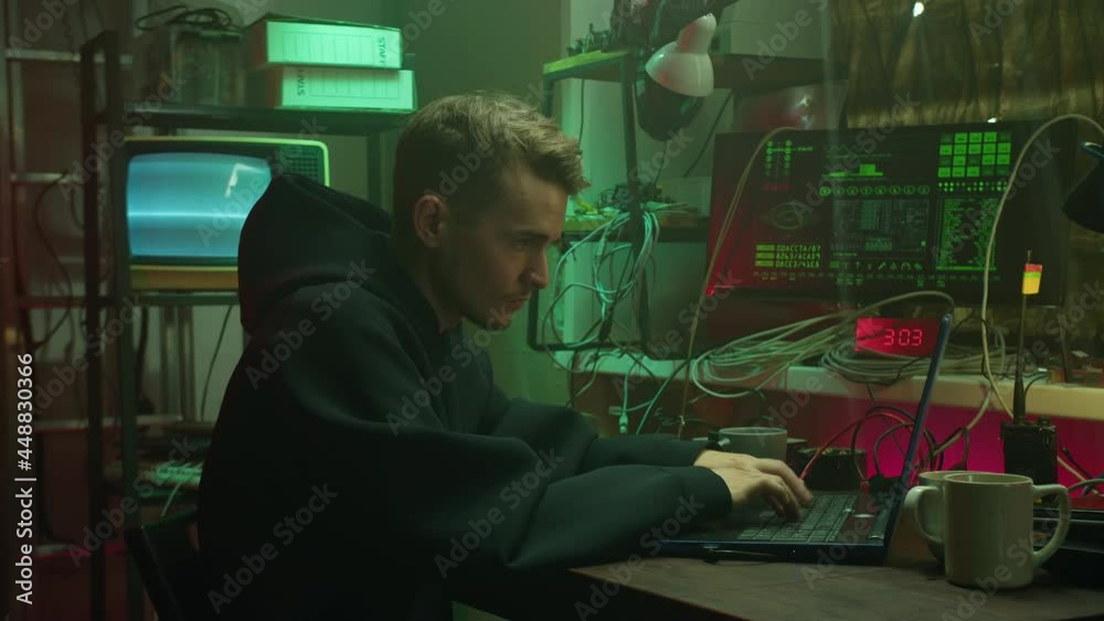 Hacker Typing On Keyboard At Night Breaking Password Using Laptop And