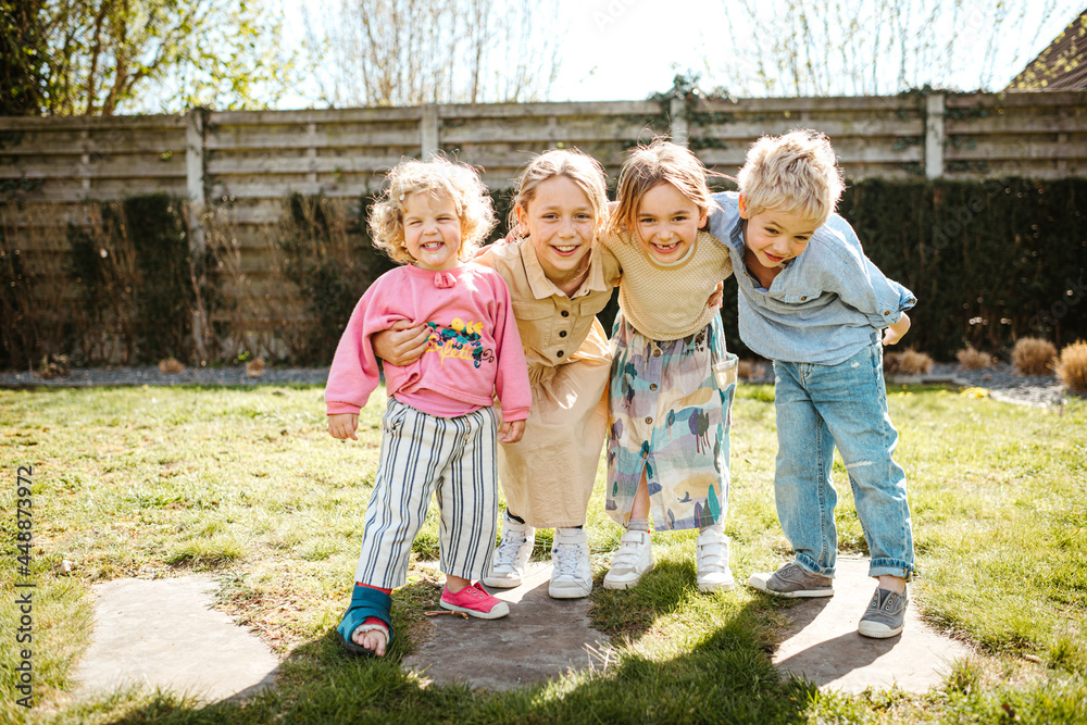 Group portrait of 4 siblings Stock Photo | Adobe Stock