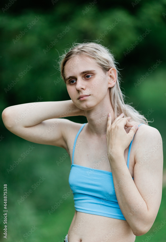 Young transgender woman outdoors Stock Photo | Adobe Stock