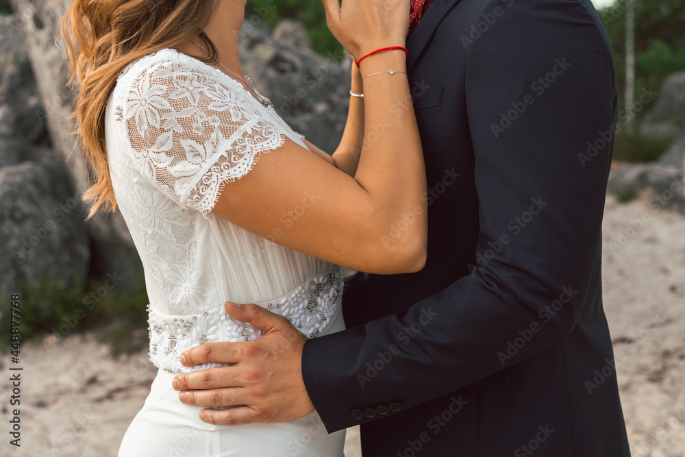 Bride and groom hugging in nature Stock Photo | Adobe Stock