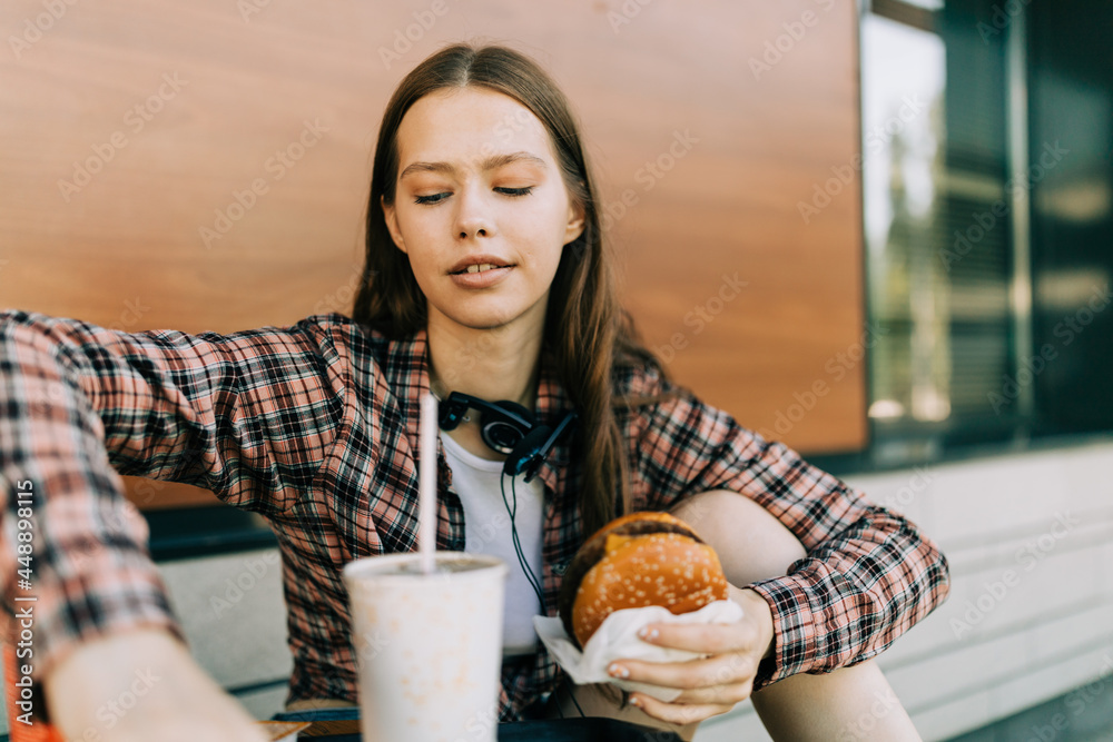 young woman in fast-food Stock Photo | Adobe Stock