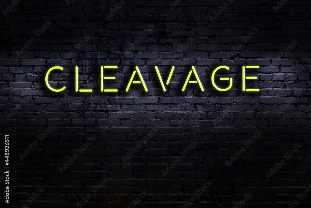 Neon sign. Word cleavage against brick wall. Night view Stock ...